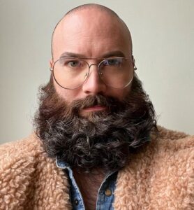18 Smart and Rugged Beard Styles for Bald Men with Glasses